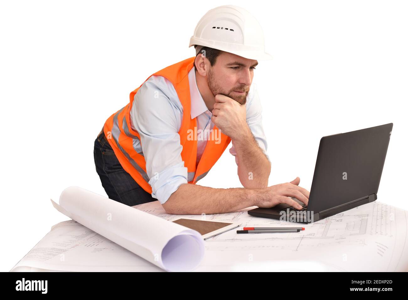 Architect / engineer at his desk planning the construction of a house ...