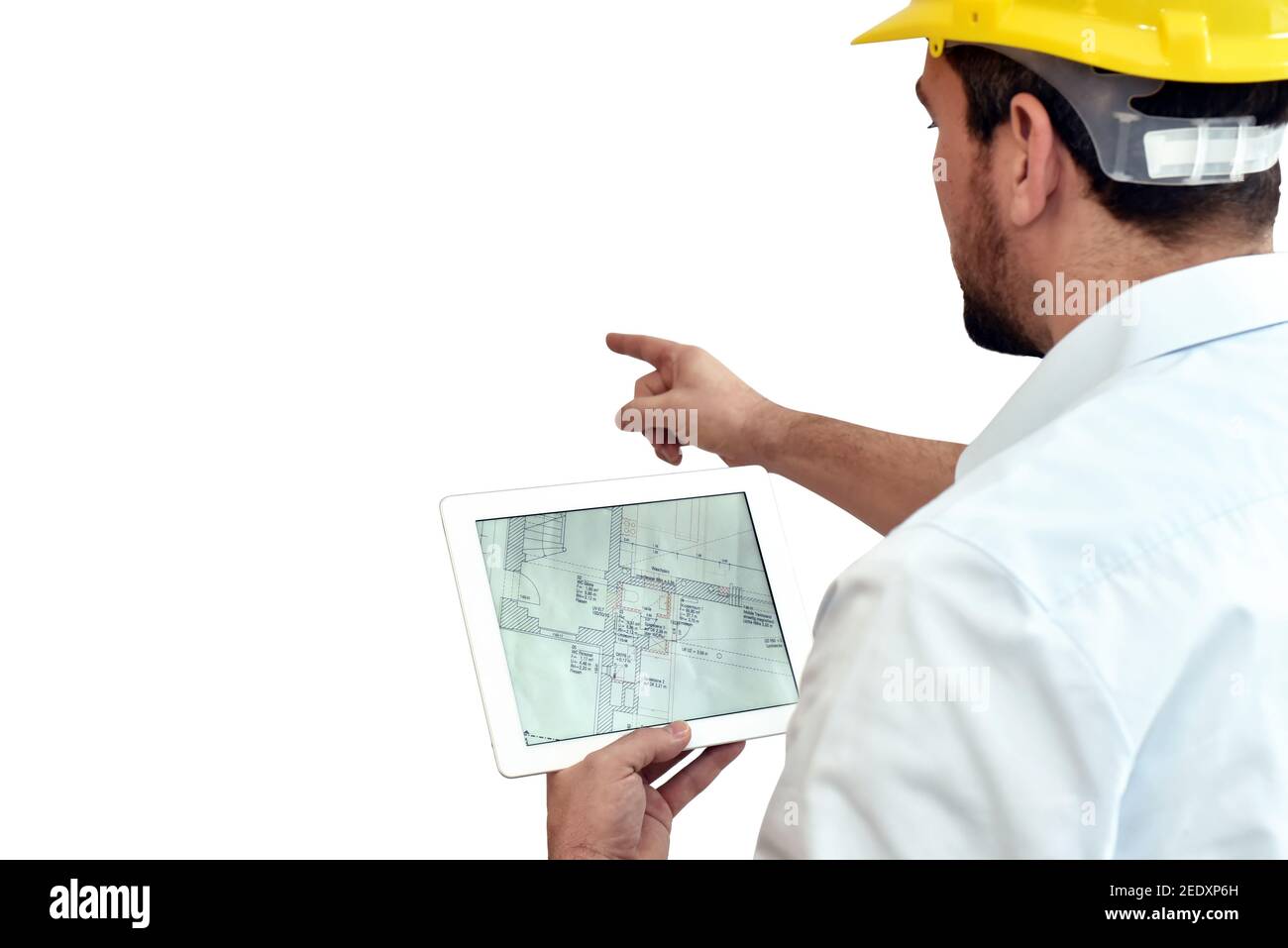 Architect / engineer at his desk planning the construction of a house ...