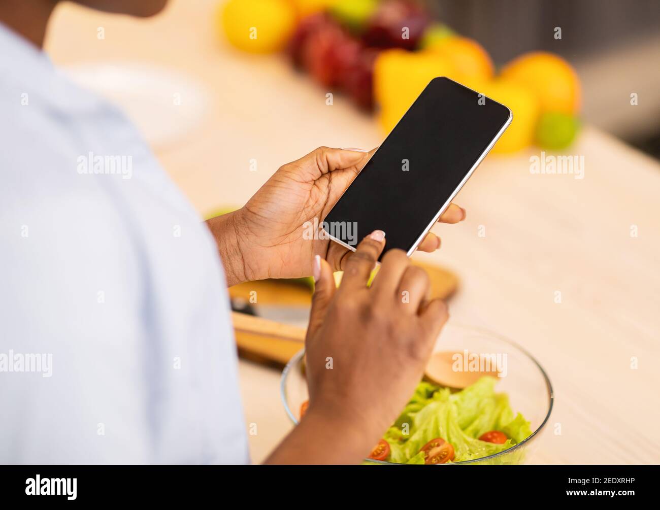 Closeup woman in kitchen using hi-res stock photography and images - Alamy
