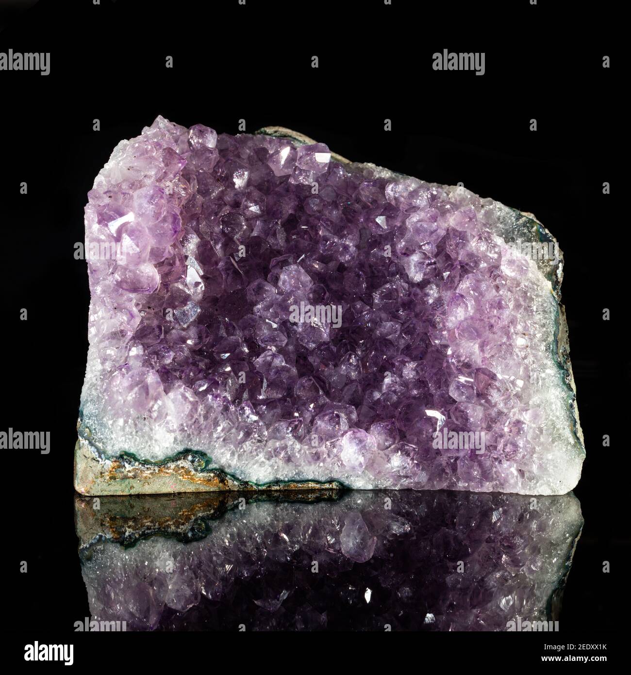 Amethyst rock on black reflective background. Birthstone. Mineralogy ...