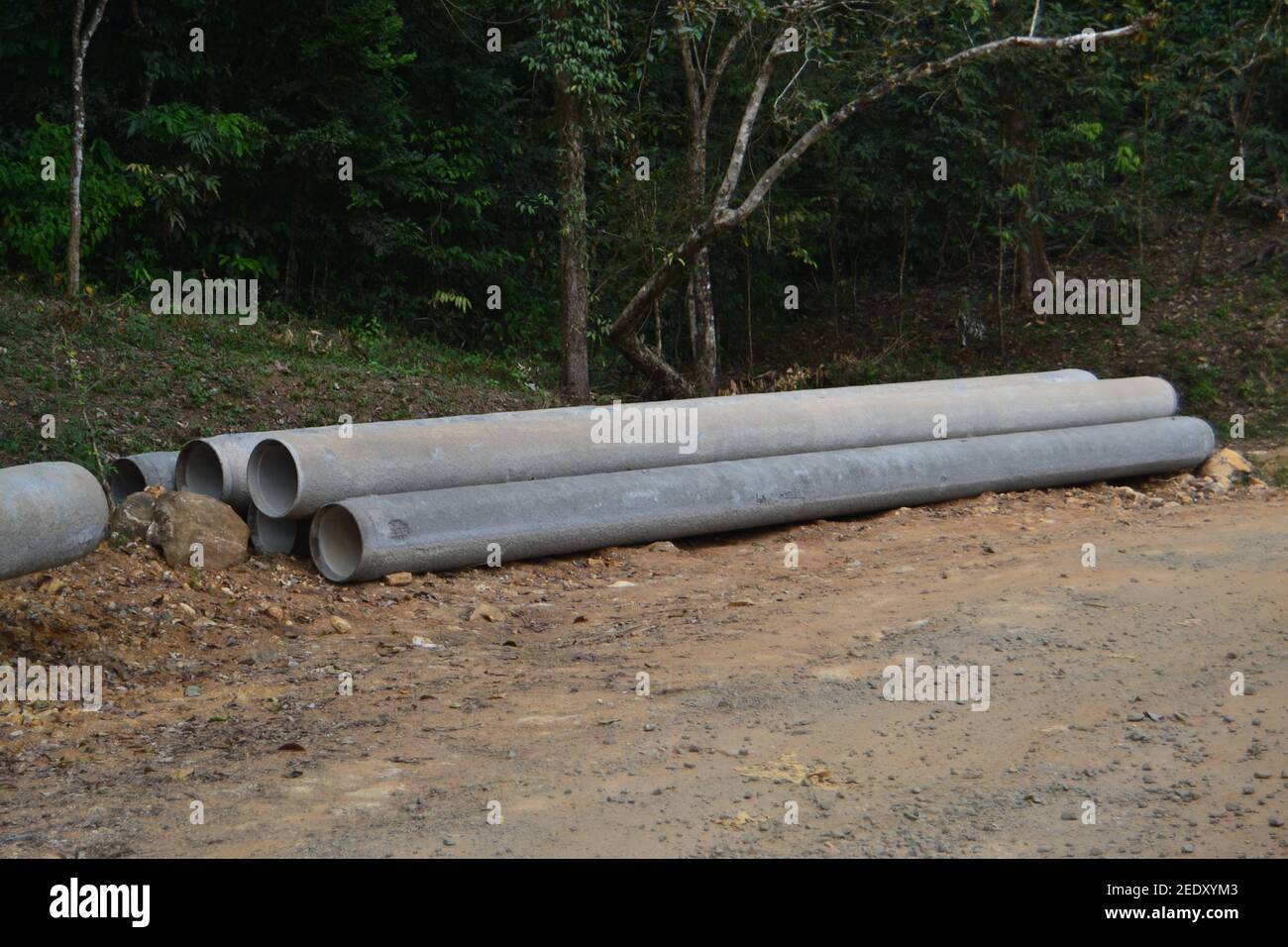 Abandoned water pipes by the roadside Stock Photo - Alamy