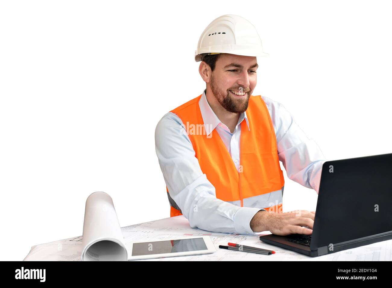 Architect / engineer at his desk planning the construction of a house ...