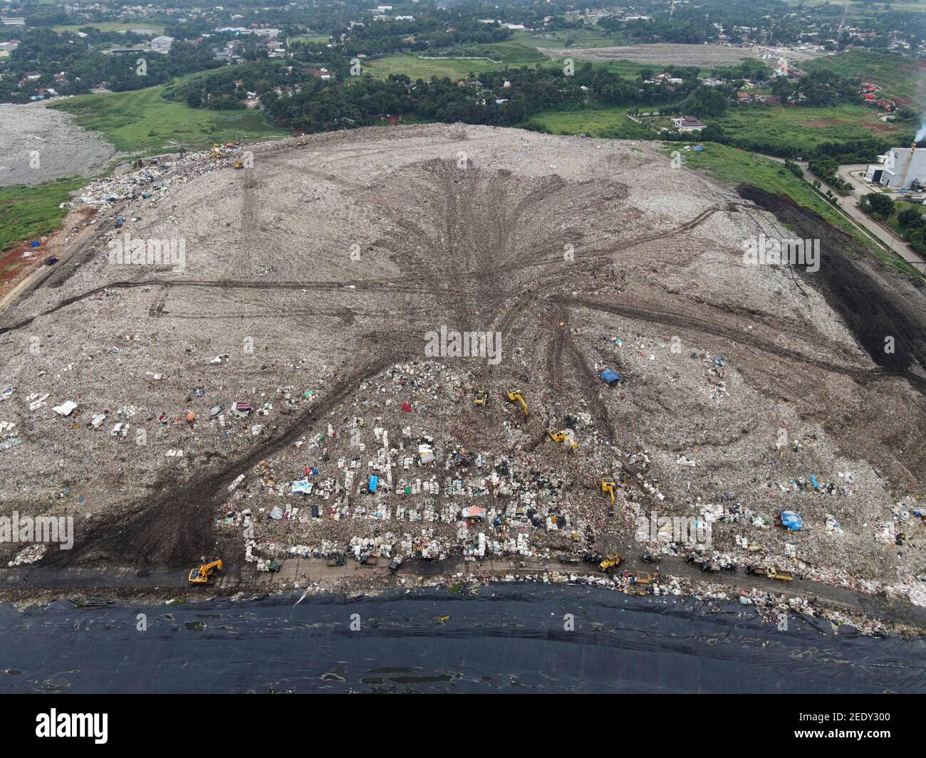 Aerial View. Large landfills like mountains. the tractor take garbage ...
