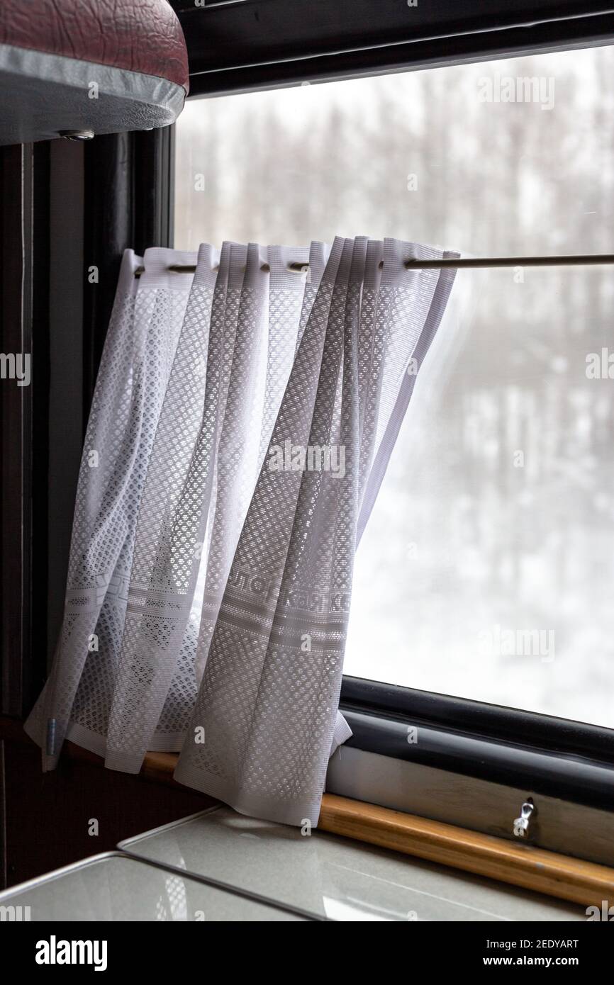Lace curtains on the window in the train carriage Stock Photo - Alamy