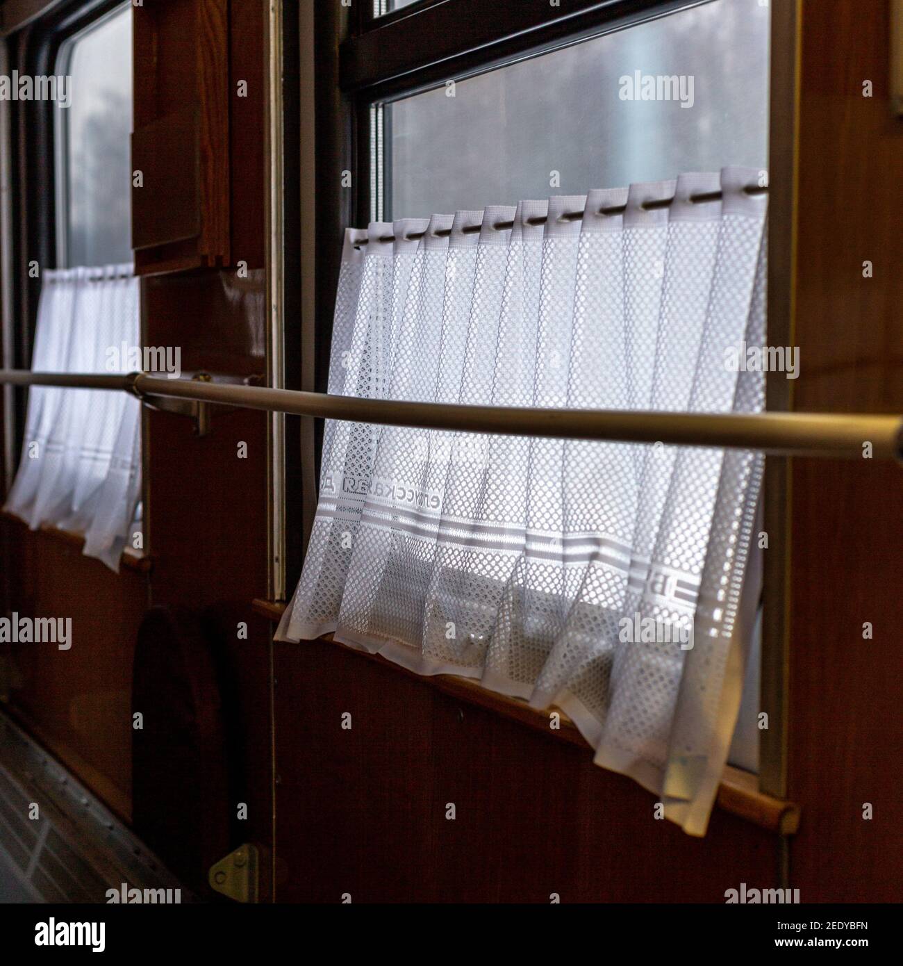 Lace curtains on the window in the train carriage Stock Photo - Alamy