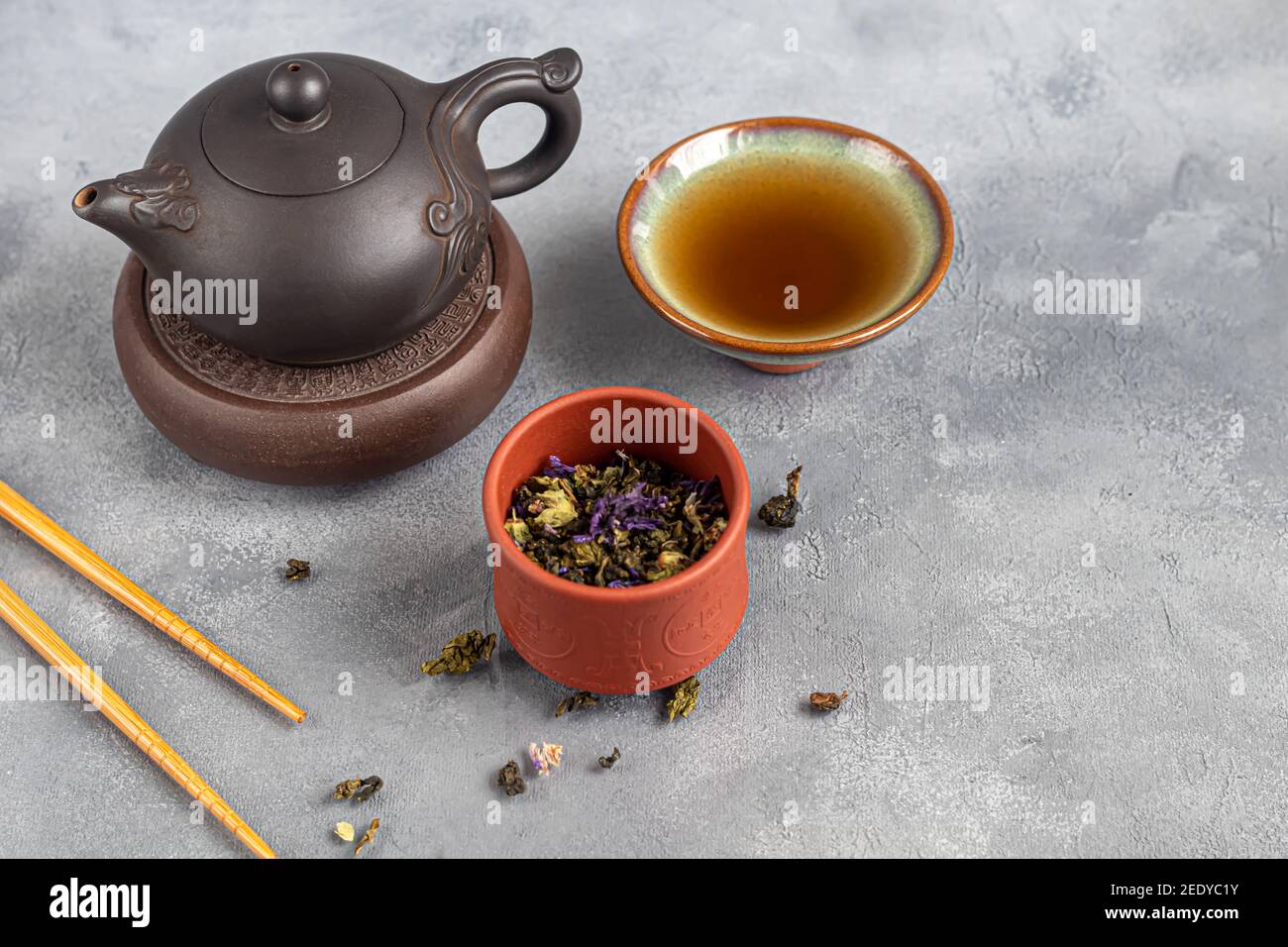 Tea ceremony. Chinese pu-erh in a bowl. In the background is a brown ...