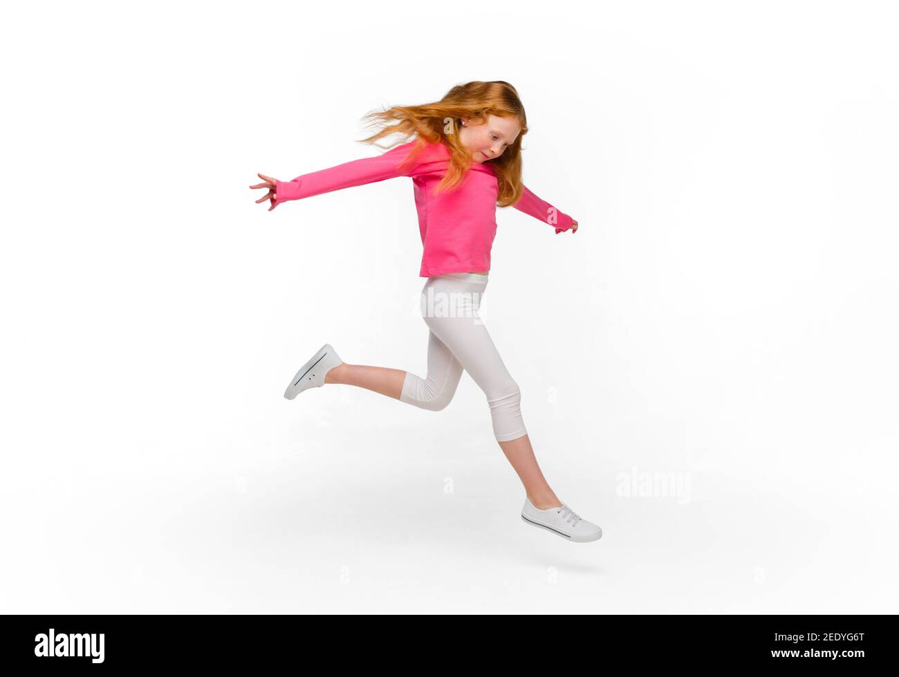 Smiling, jumping, running. Happy, smiley redhair girl isolated on white ...