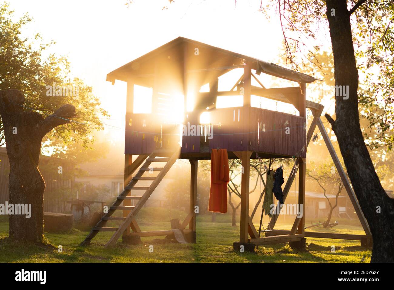 Sun shining through kids playground with dust particles. Best kids ...