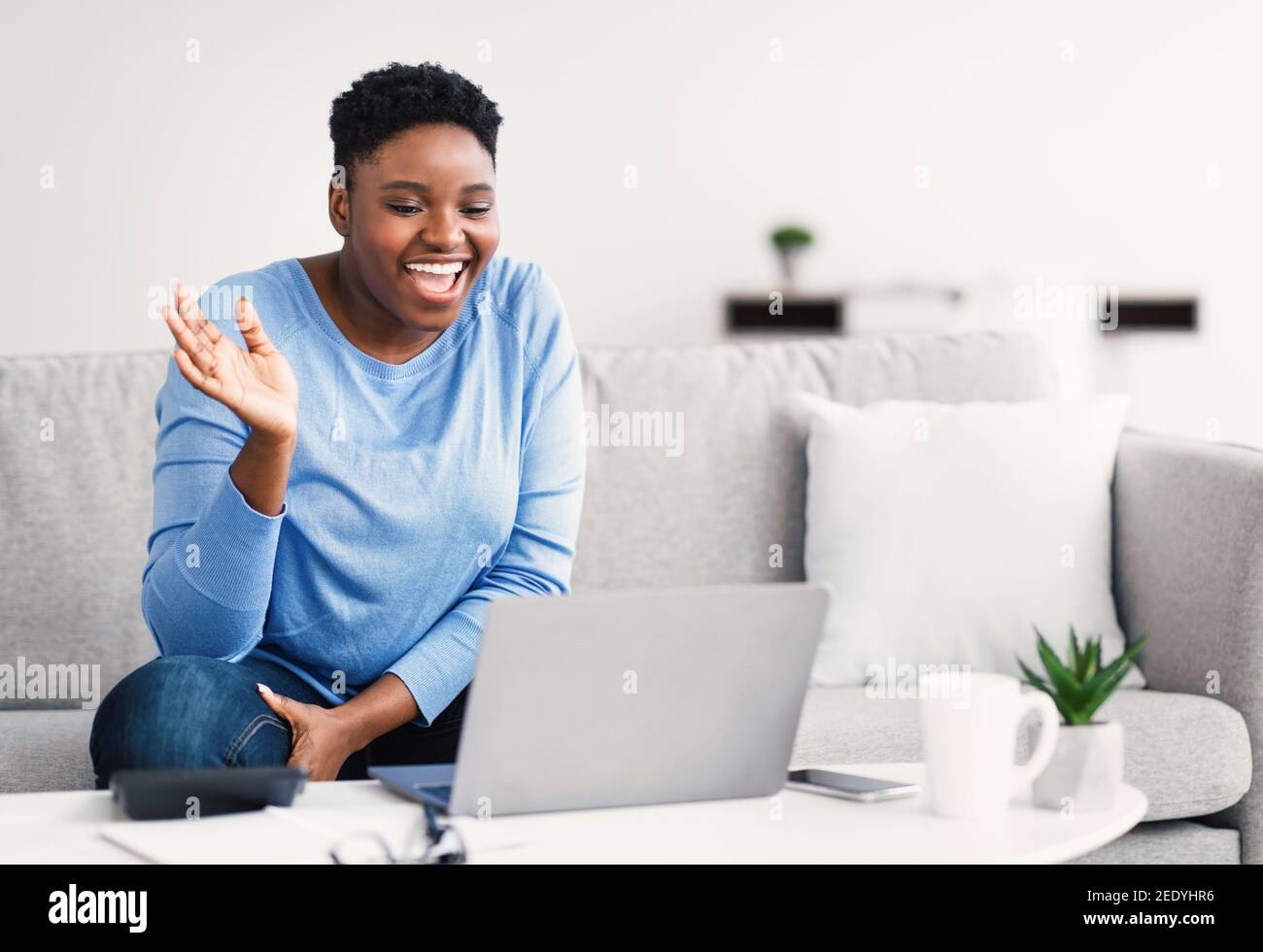 Black woman having video call using computer and gesturing Stock Photo ...