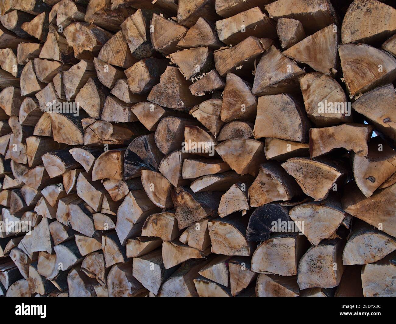 Closeup view of wood heap with stacked cut logs with wooden texture and ...