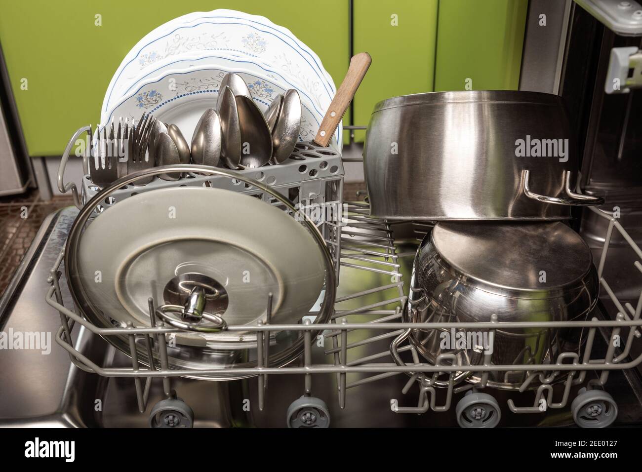 Clean plates, pots, cutlery in the dishwasher Stock Photo - Alamy
