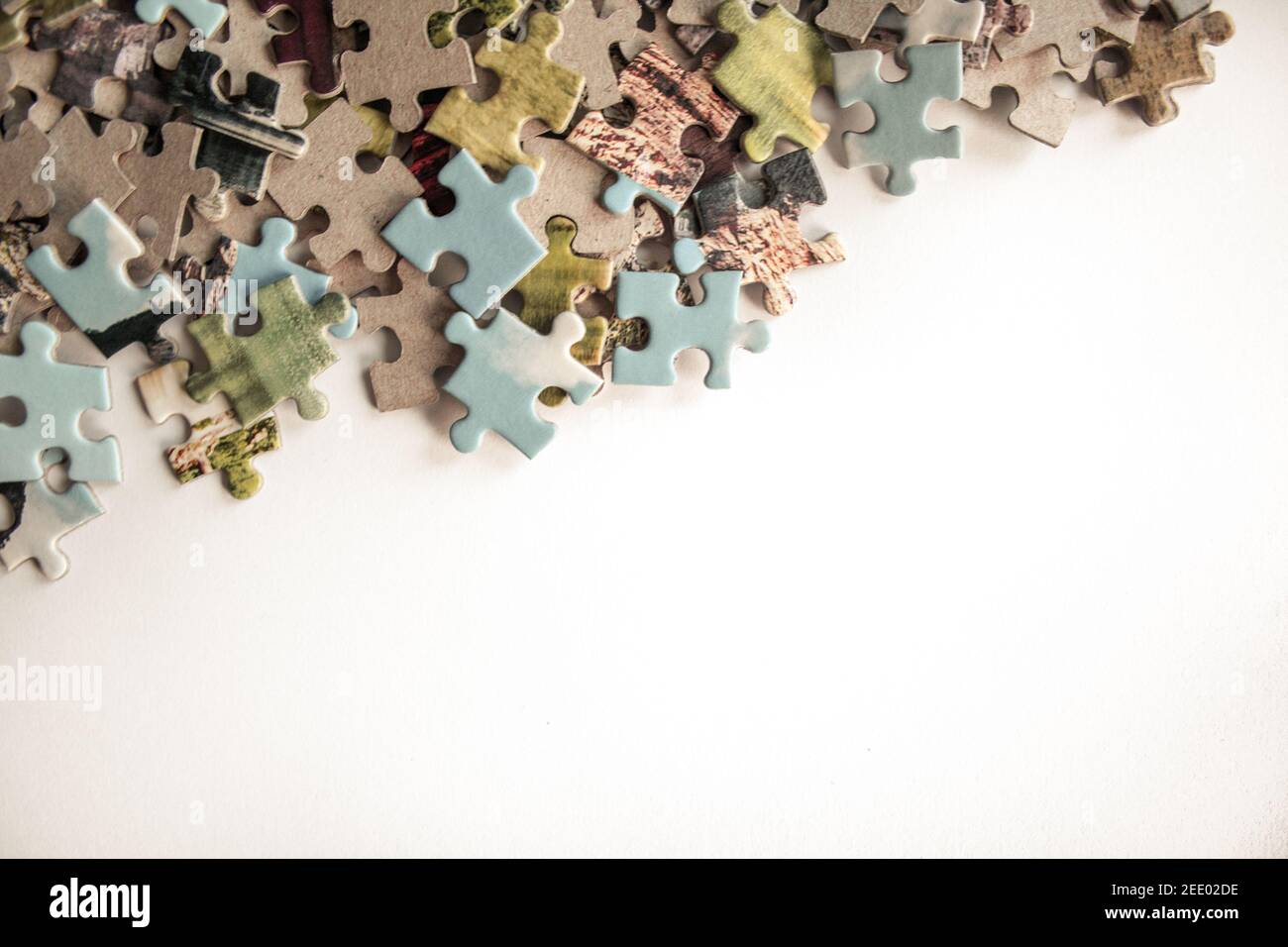 Puzzle. Background with half jigsaw puzzle and half white copy space ...