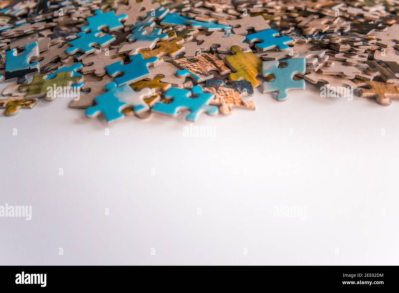 Puzzle. Background with half jigsaw puzzle and half white copy space ...