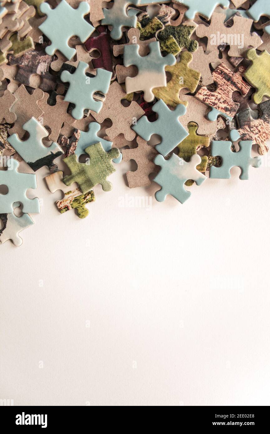 Puzzle. Background with half jigsaw puzzle and half white copy space ...