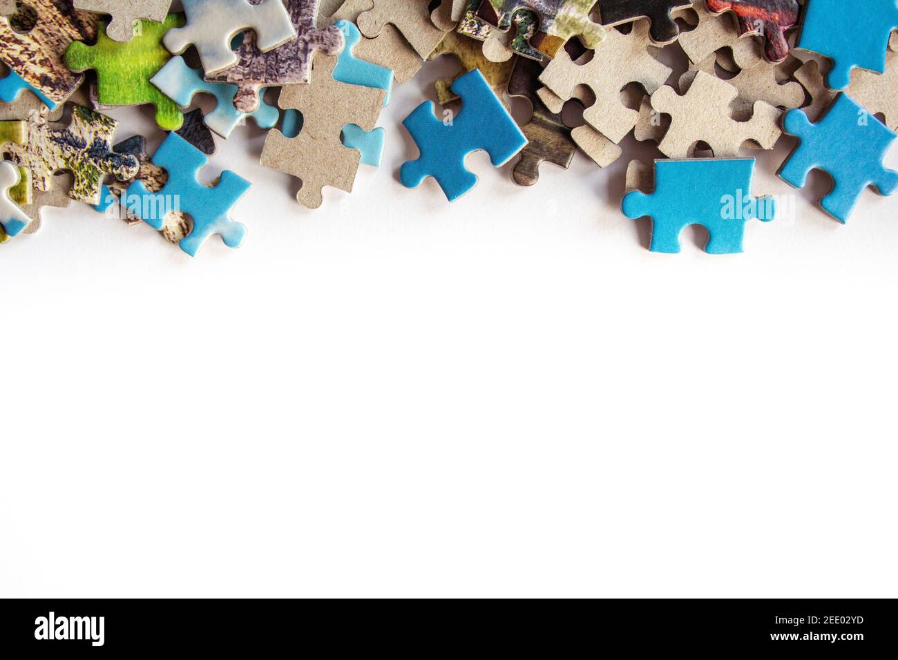 Puzzle. Background with half jigsaw puzzle and half white copy space ...