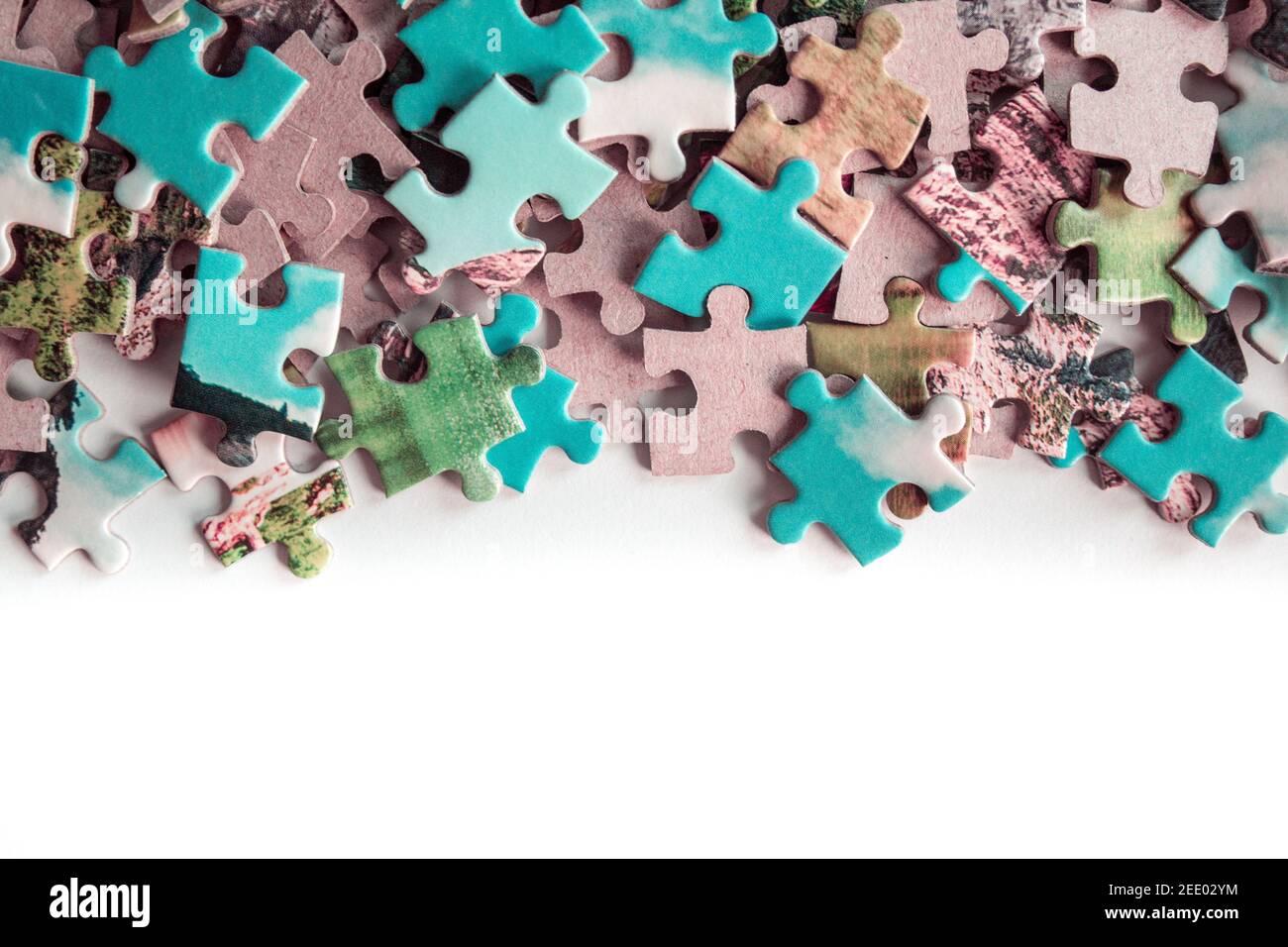 Puzzle. Background with half jigsaw puzzle and half white copy space ...