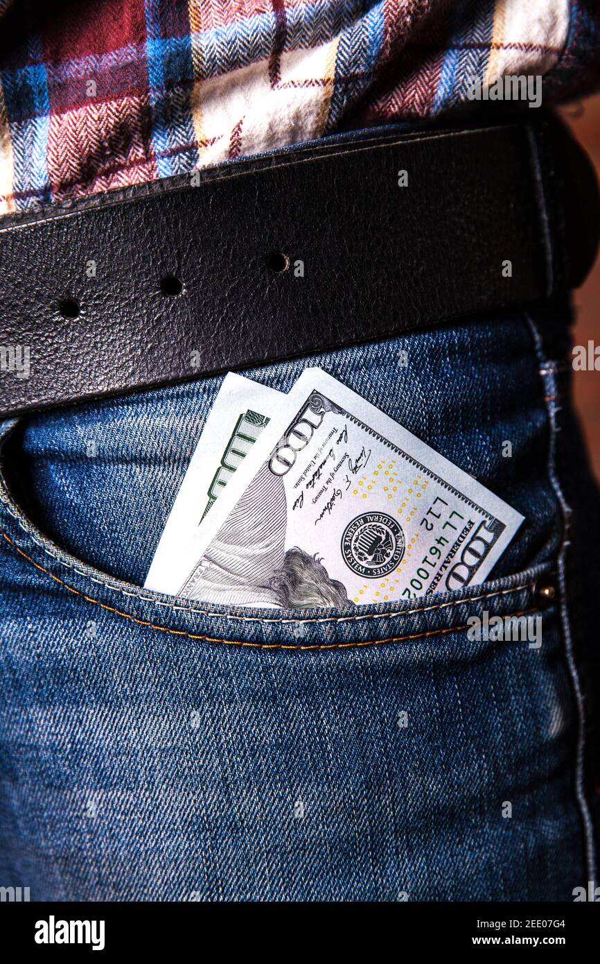 dollars in a jeans pocket, closeup Stock Photo - Alamy