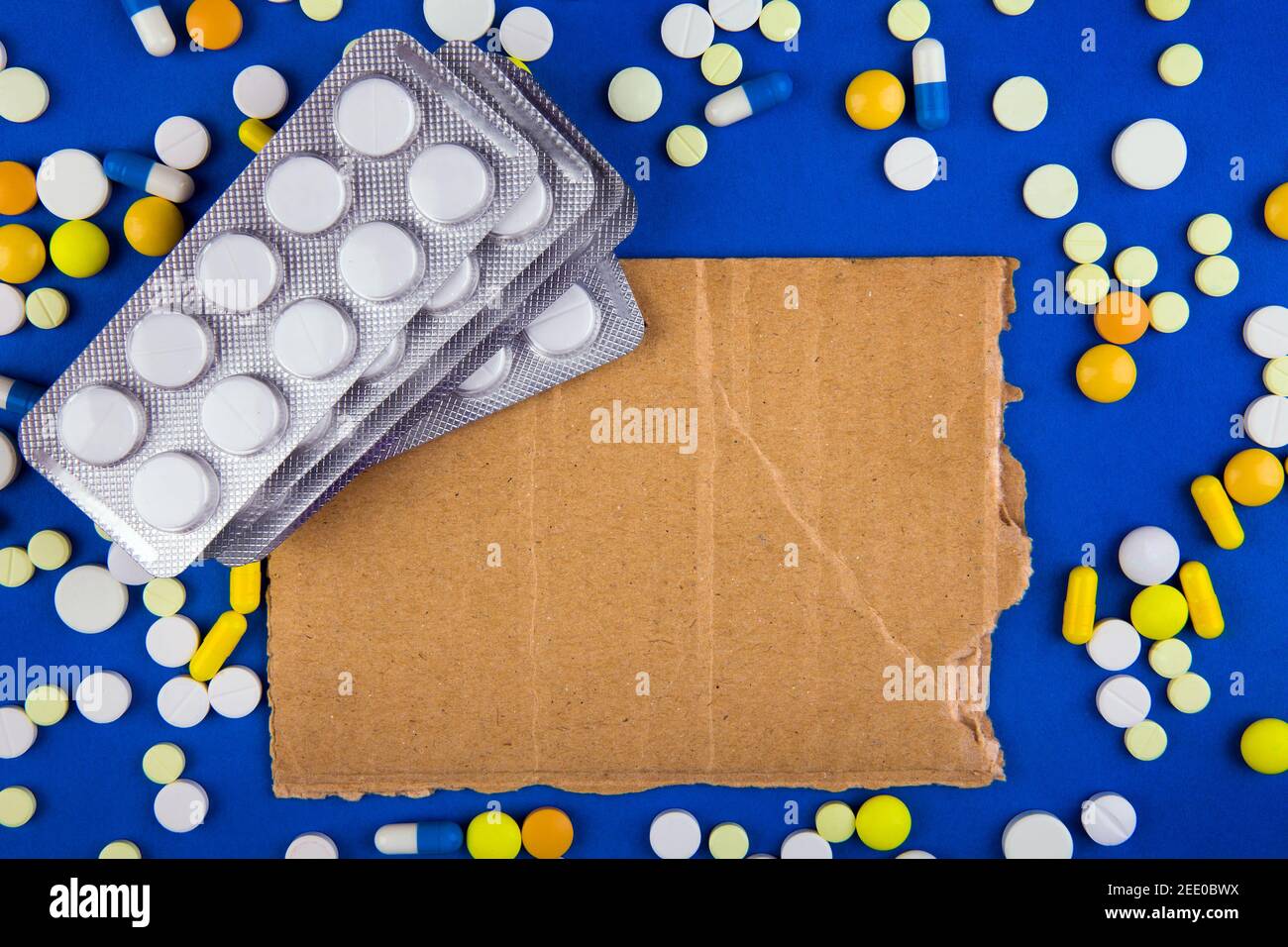 Pills and Empty Old Cardboard on the Blue Paper Background Stock Photo ...