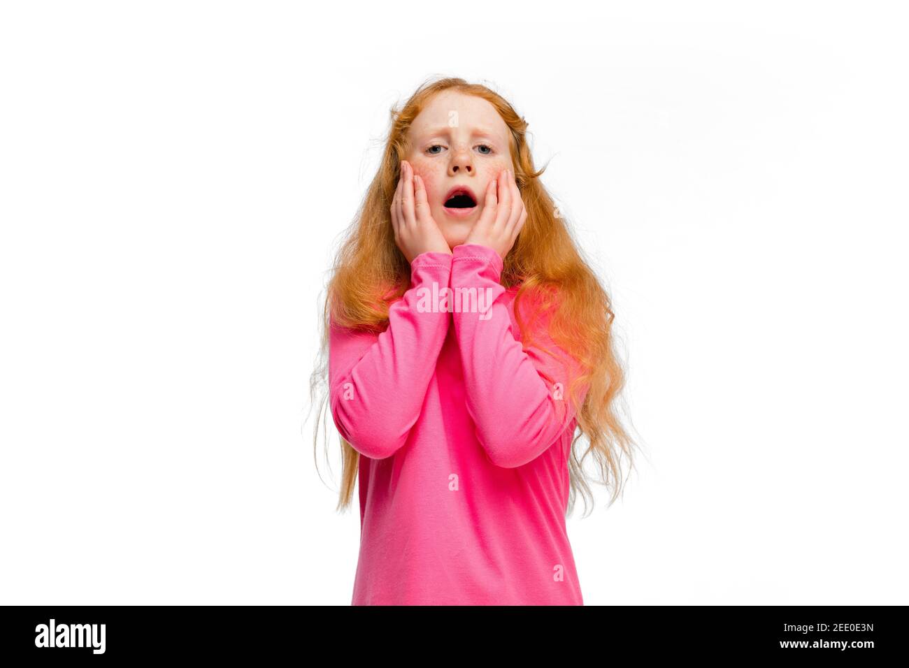 Frightened, shocked. Happy, smiley redhair girl isolated on white ...