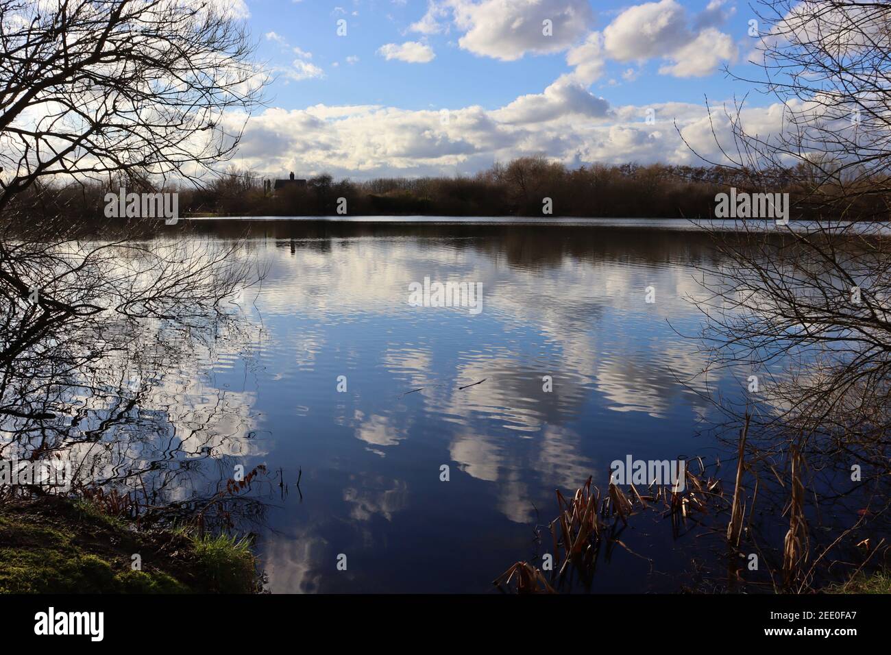 Cloudy reflections on lake Stock Photo - Alamy
