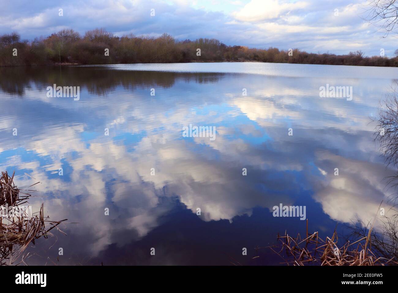 Cloudy reflections on lake Stock Photo - Alamy
