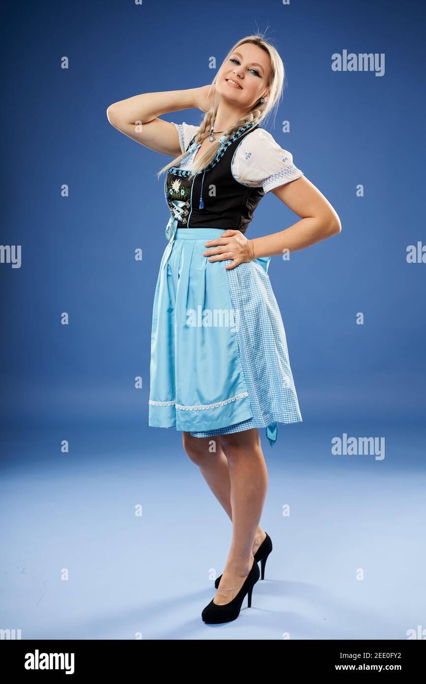 Full length of a German blonde young woman in traditional costume on ...