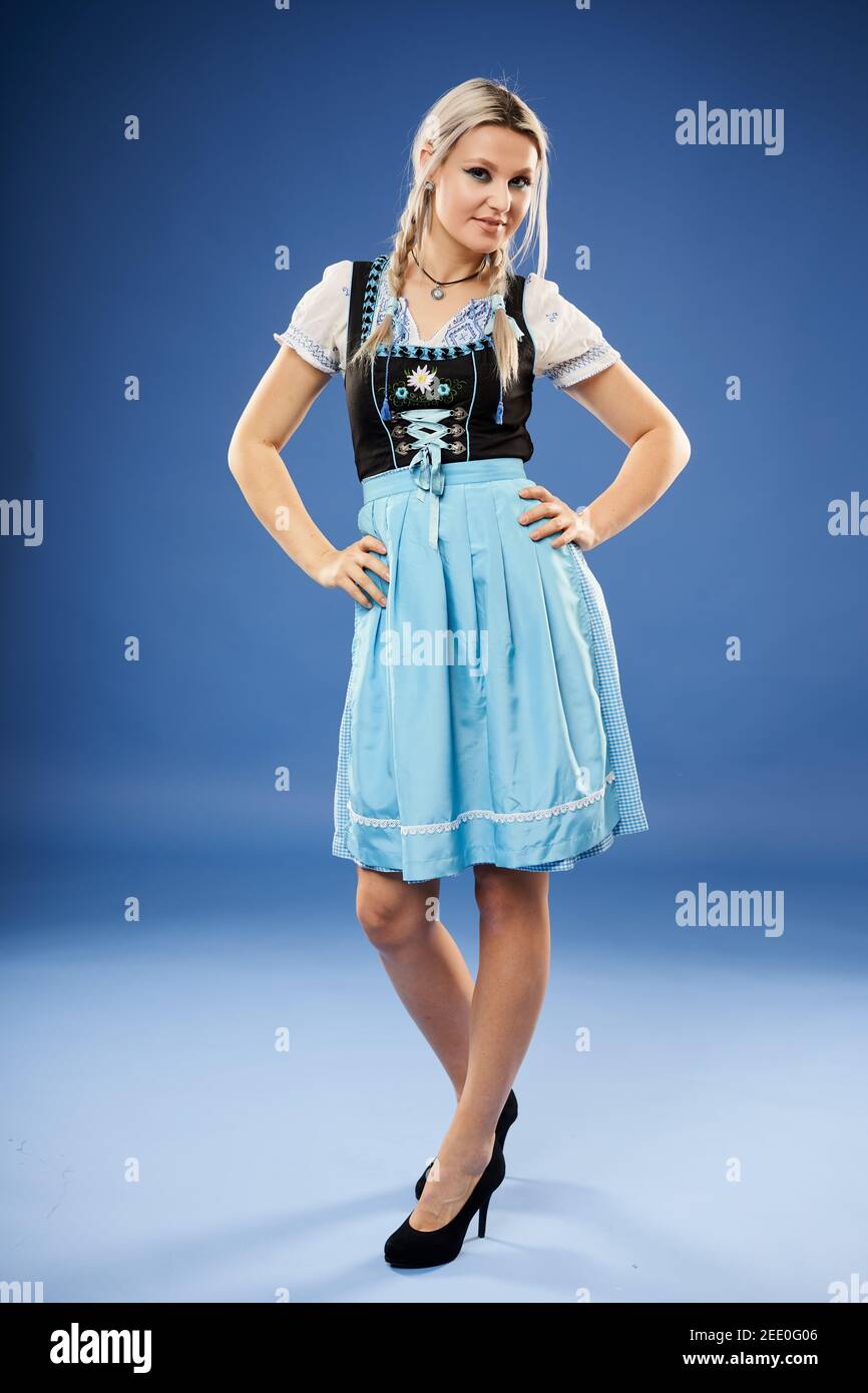 Full length of a German blonde young woman in traditional costume on ...