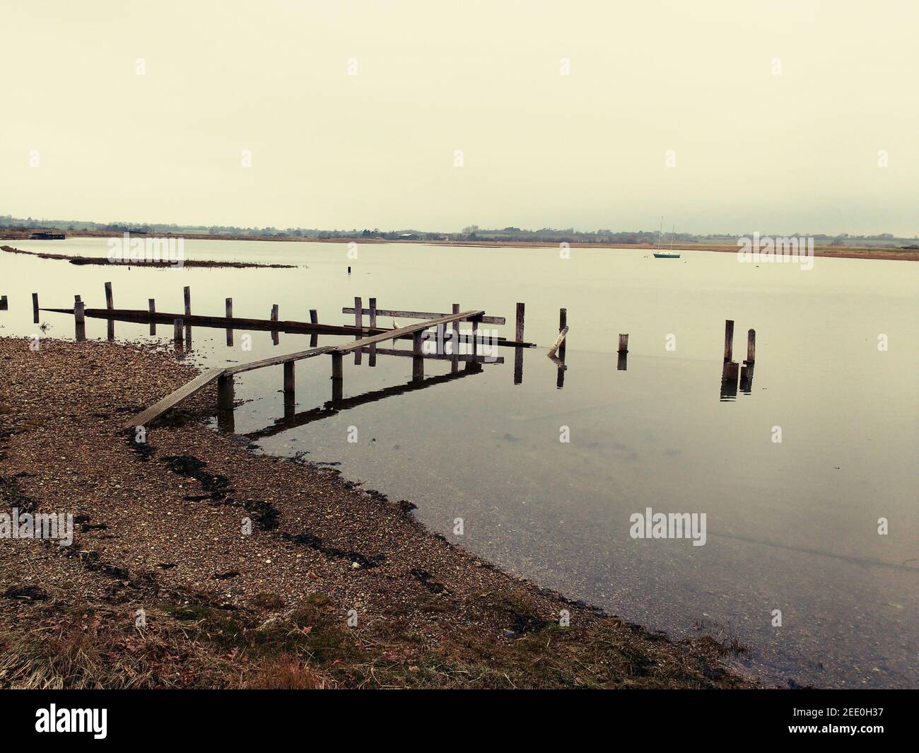 Wooden posts shore sky sunset beach hi-res stock photography and images ...