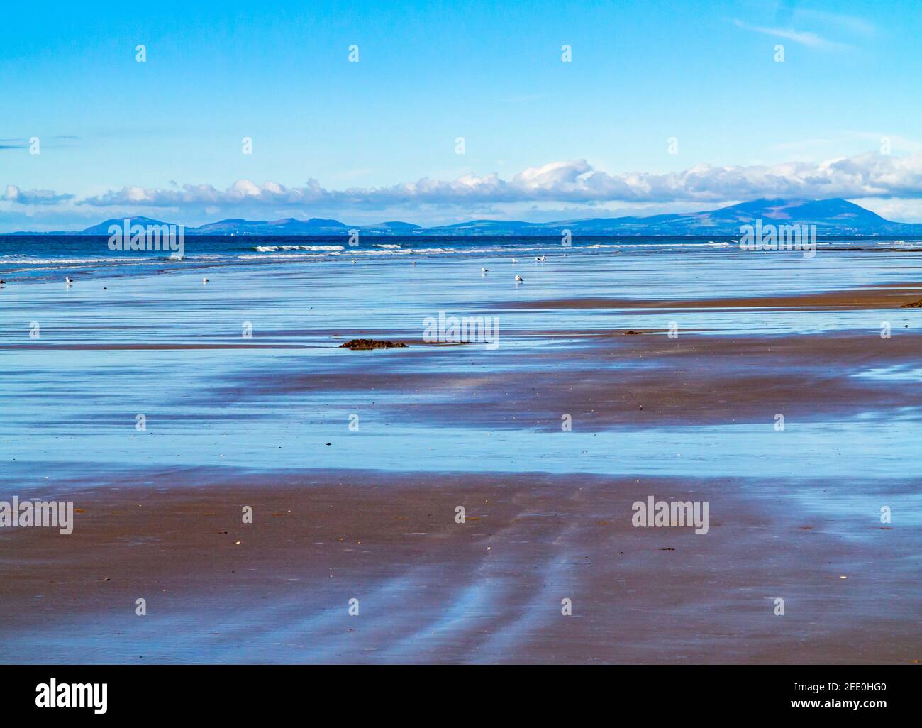 The sandy beach at Barmouth Bay or Abermaw in Gwynedd on the north west ...