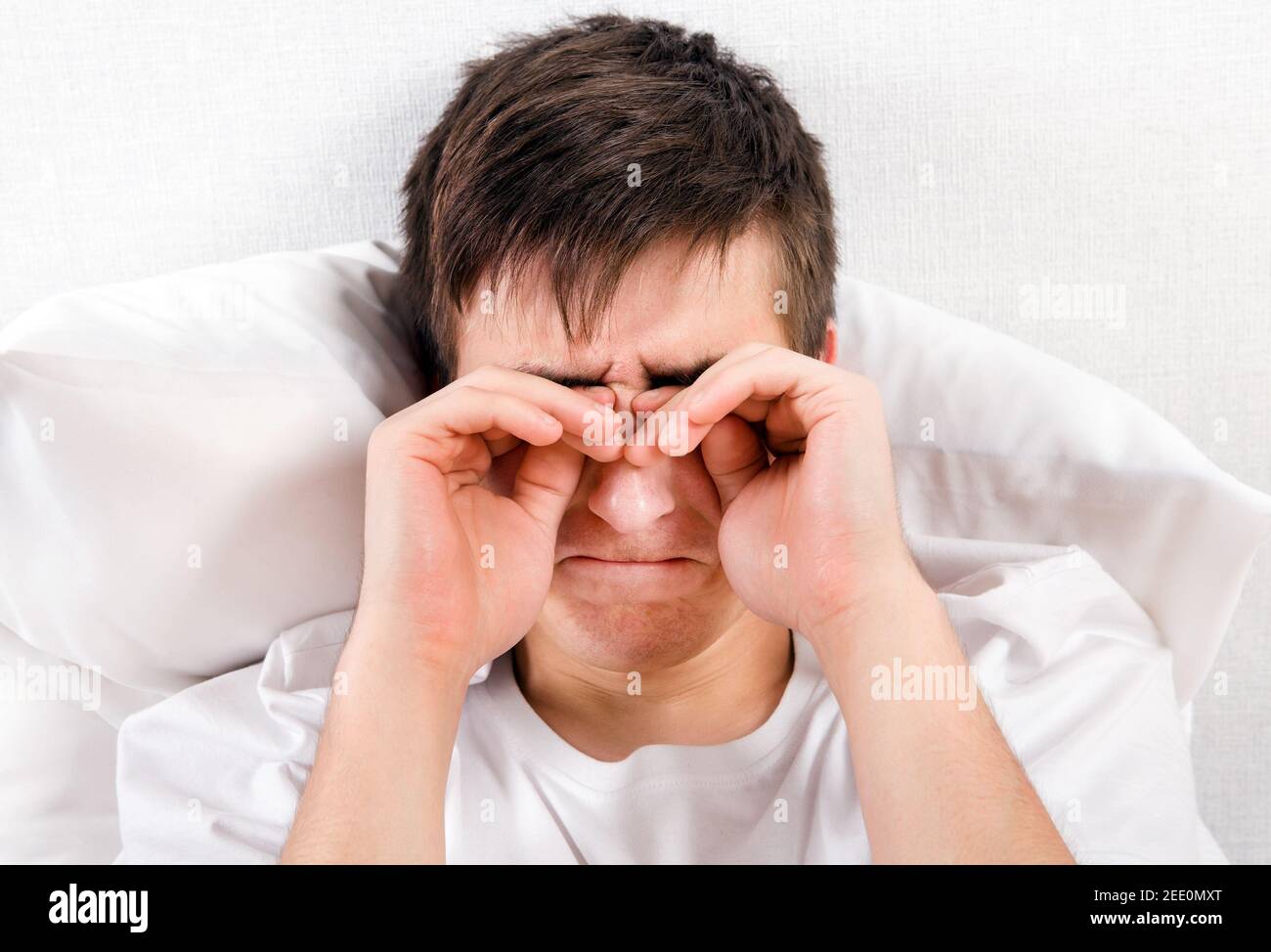 Man crying bed hi-res stock photography and images - Alamy