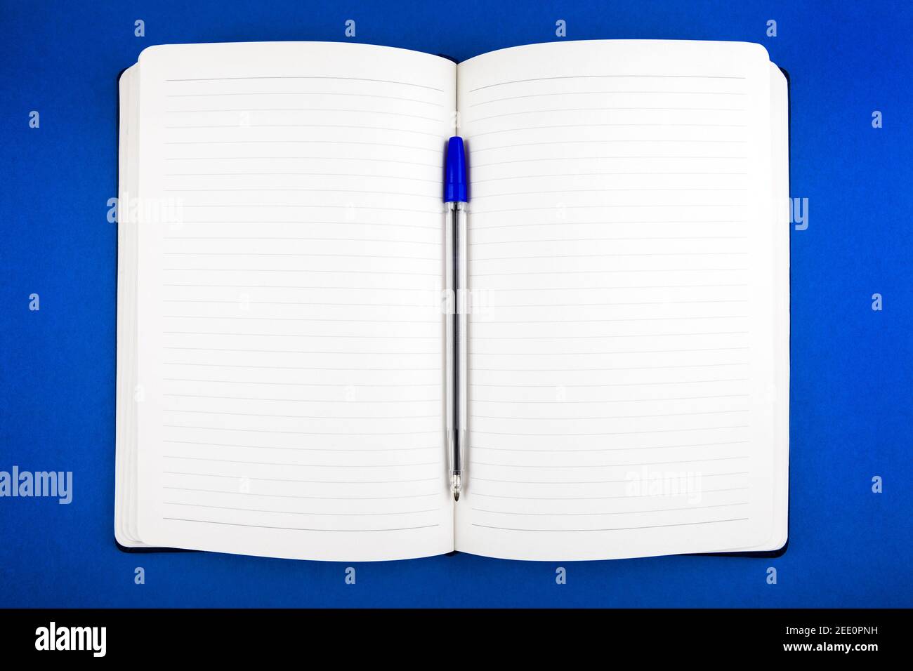 Blank Writing Pad on the Blue Paper Background closeup Stock Photo - Alamy