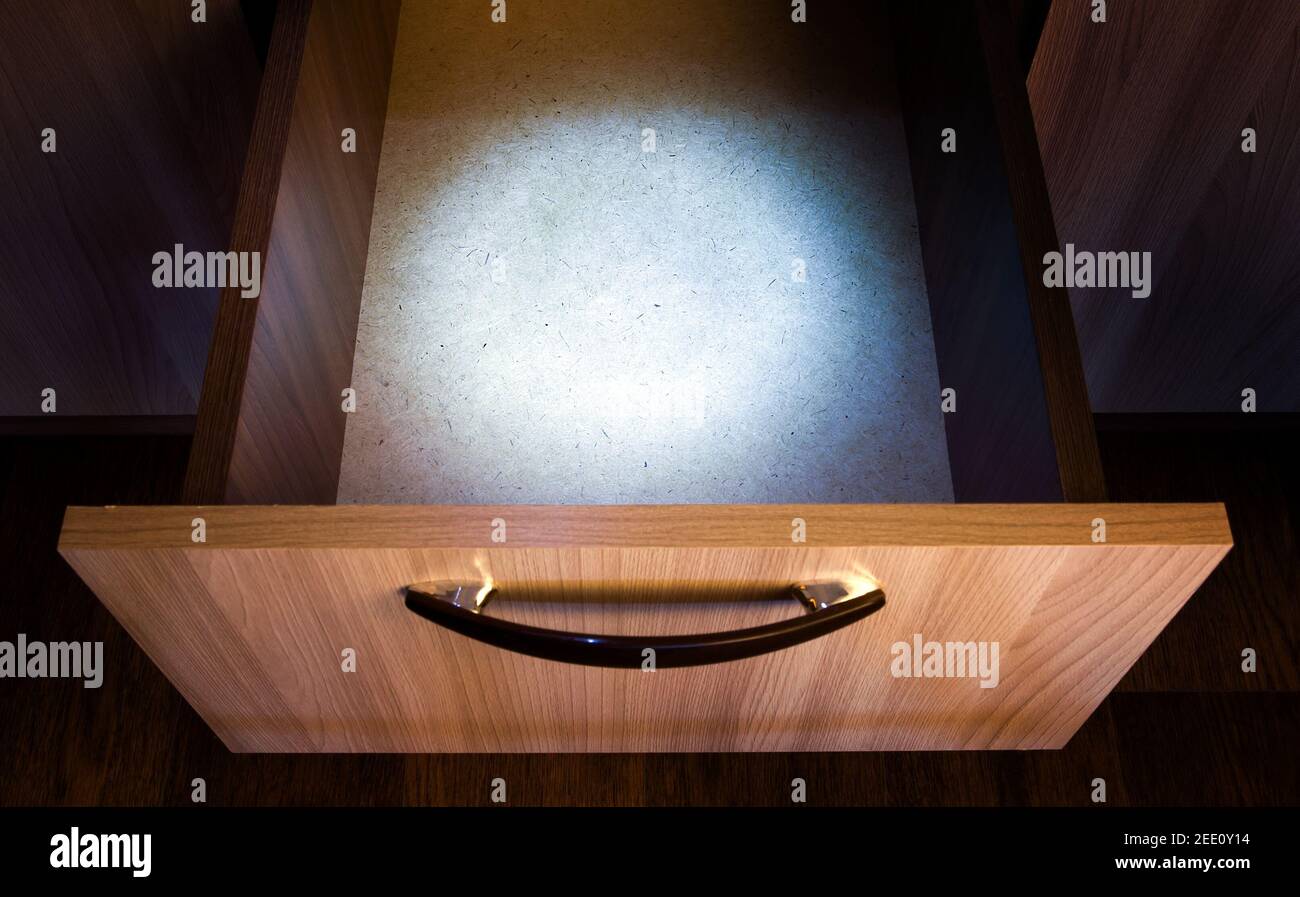 Empty Opened Drawer of the Furniture with a Spot of the Light Stock ...