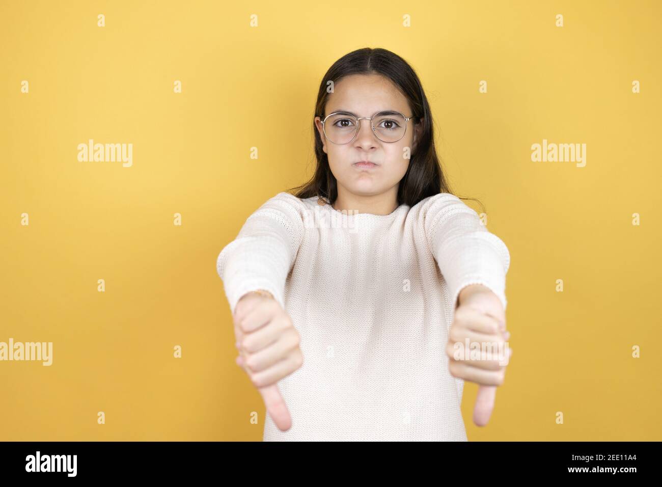 Beautiful child girl wearing casual clothes with angry face, negative ...