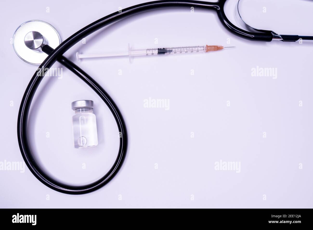 Doctor blue stethoscope for cardiac on white background with syringe ...