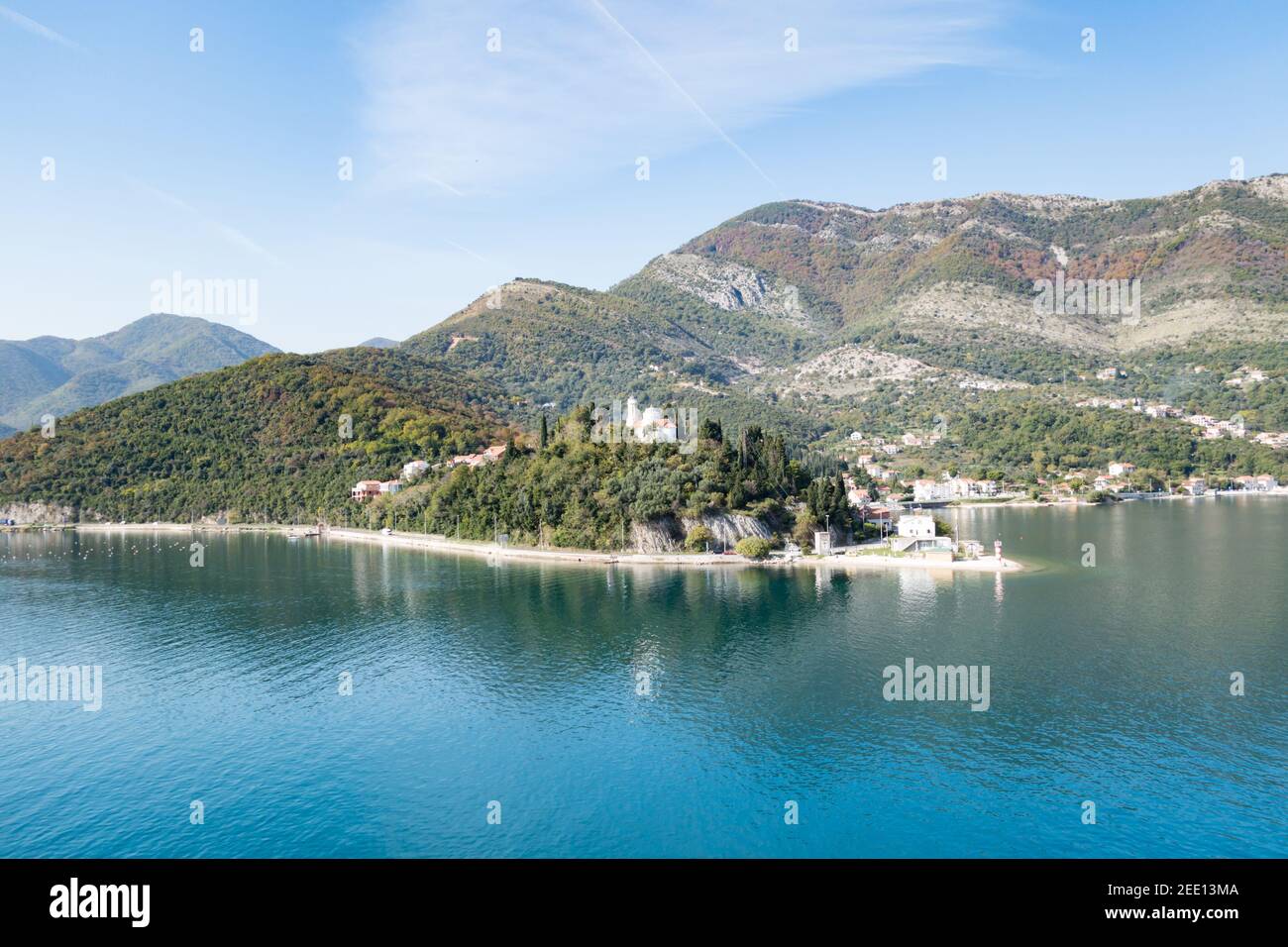 View of Bay of Kotor from the sea surrounded by mountains in Montenegro ...