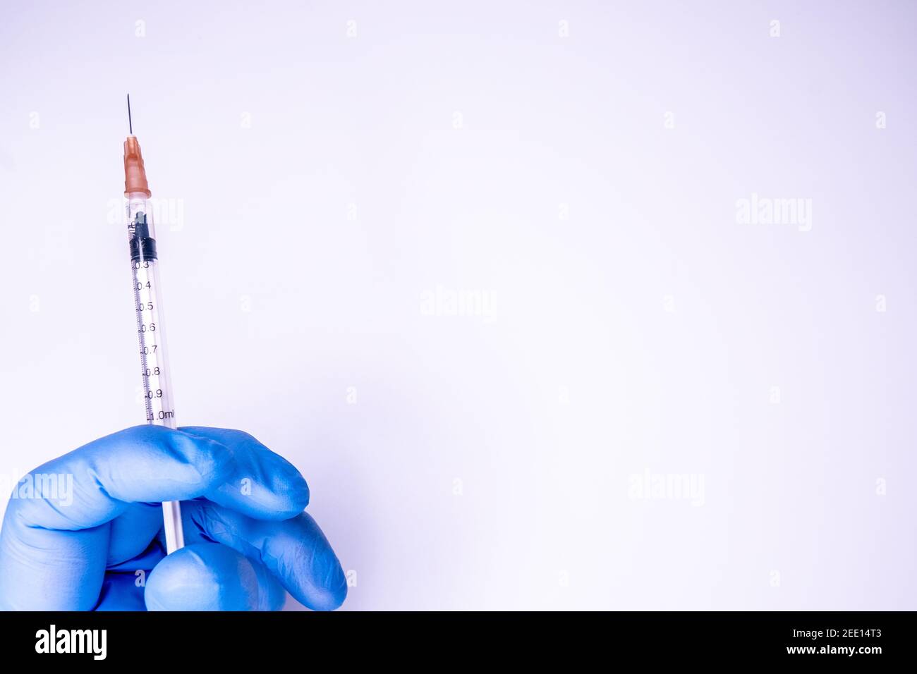 Syringe, medical injection, bottle, ampule in hand, palm or fingers ...