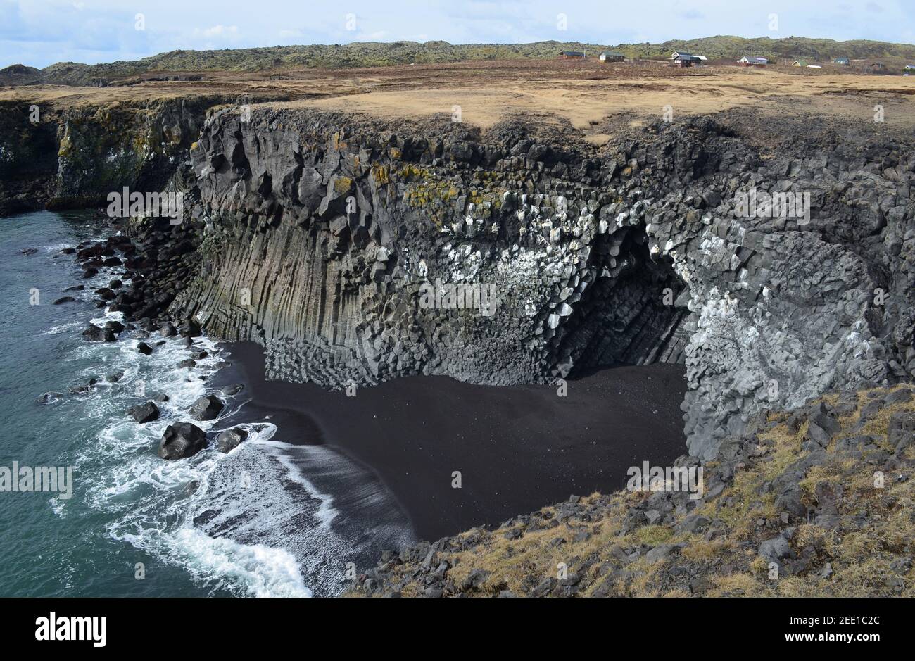 Stunning black sand beach with basalt column cavern located along ...