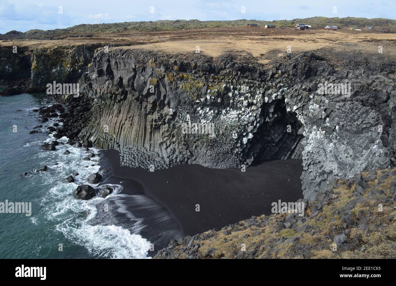 Stunning Icelandic black sand beach with basalt columns and a cavern ...