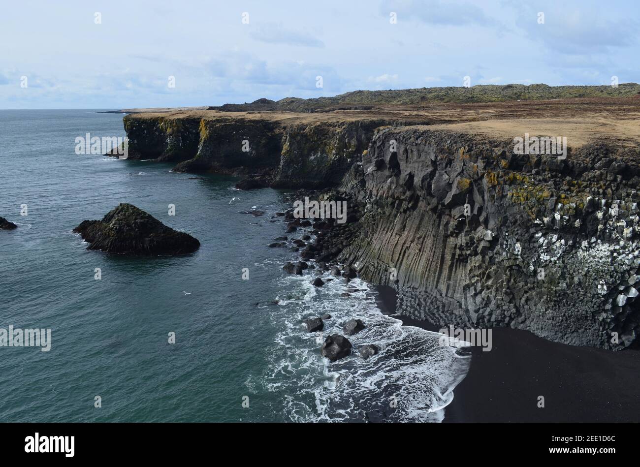 Stunning black sand beach and basalt columns in Iceland Stock Photo - Alamy