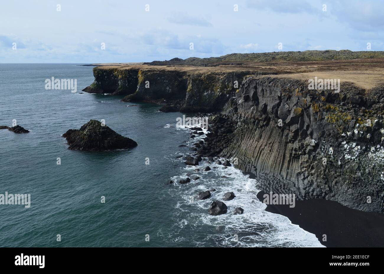 Iceland's beautiful basalt column rock cliff along the coastline Stock ...
