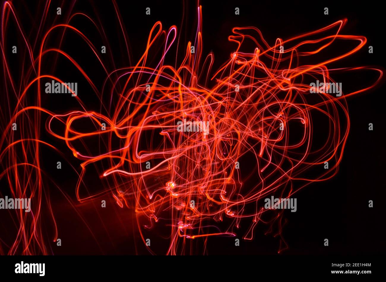 Abstract background with red neon lights Stock Photo - Alamy