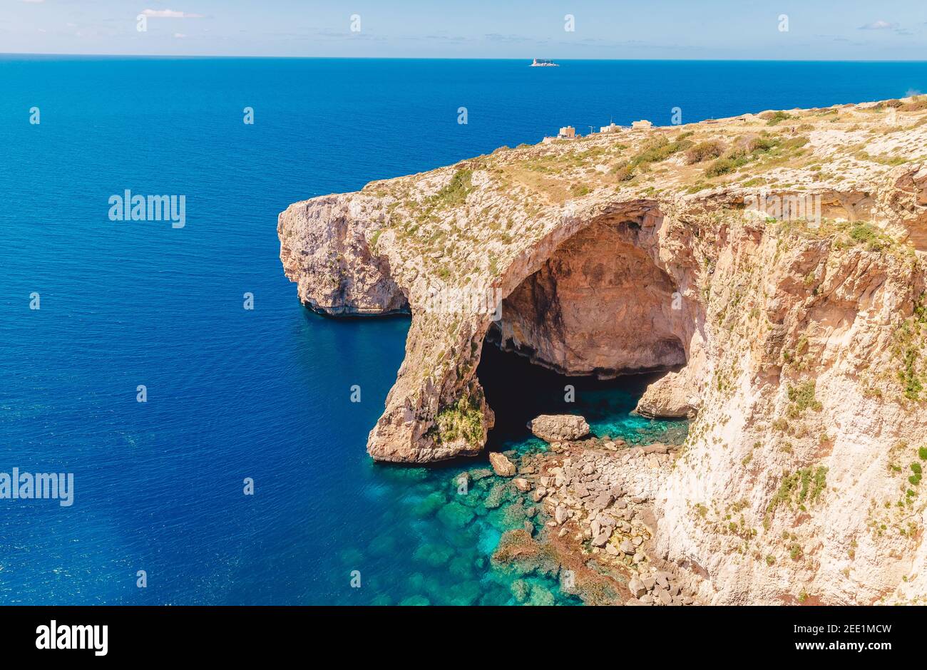Blue Grotto in Malta. Pleasure boat with tourists runs. Natural arch ...