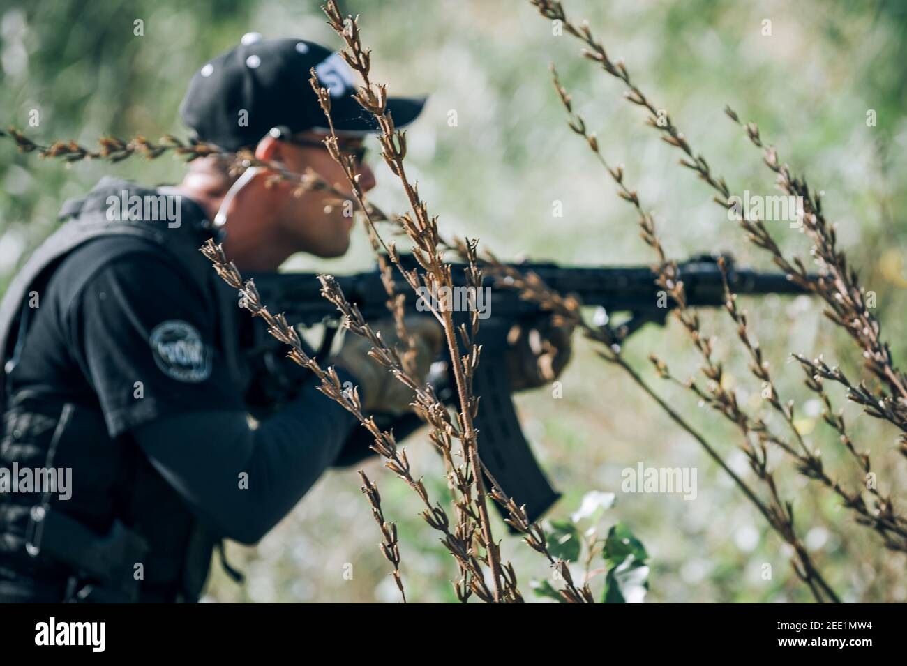 Military army soldier in action tactical combat shooting from rifle ...