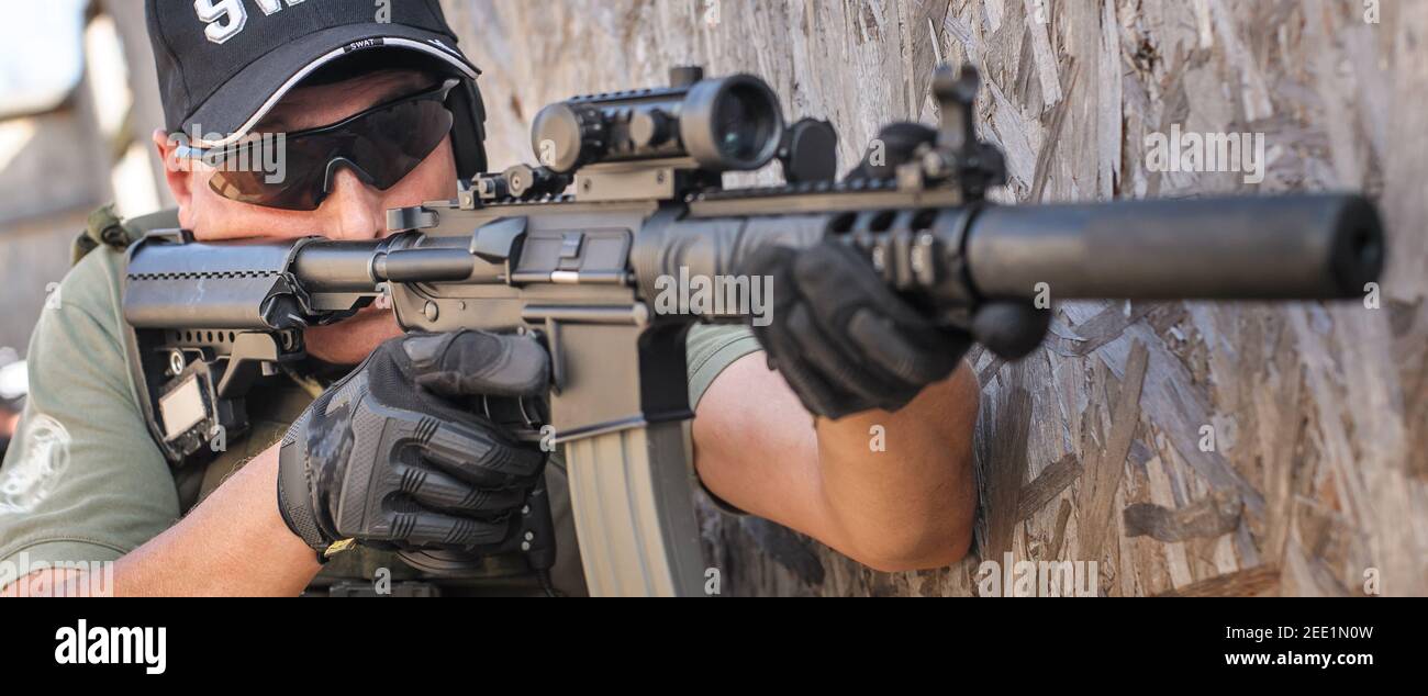 Military army soldier in action tactical combat shooting from rifle ...