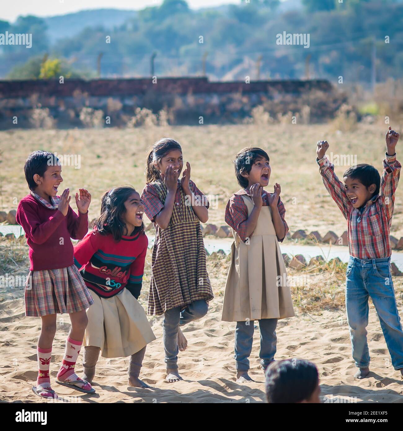 Uttar Pradesh. 05-15-2018. Children ar laughing while playing outside ...