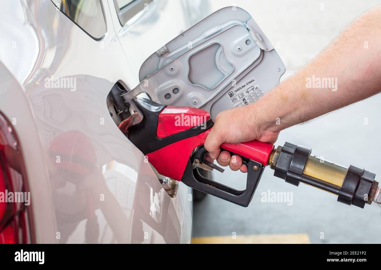 Person filling fuel into the car Stock Photo - Alamy