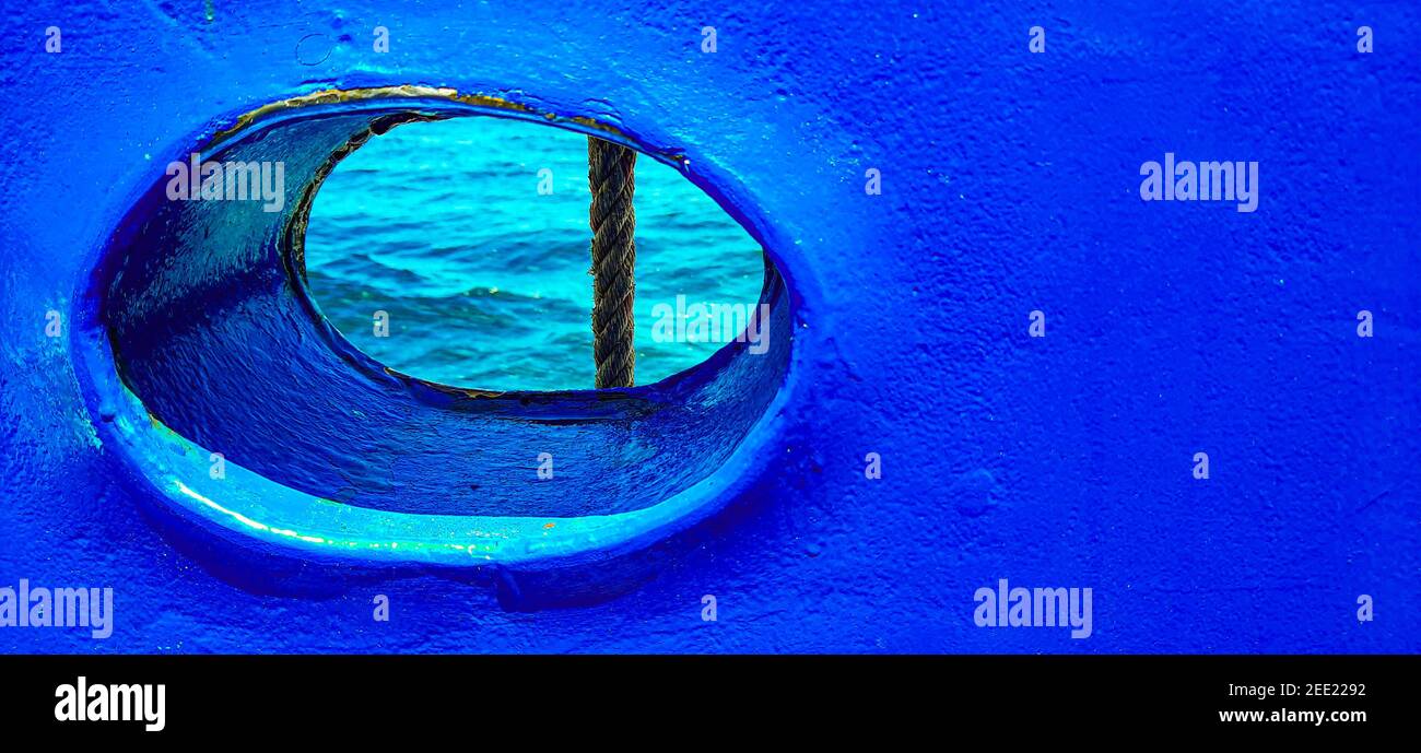 Bull´s eye in a blue iron wall from a ship Stock Photo - Alamy