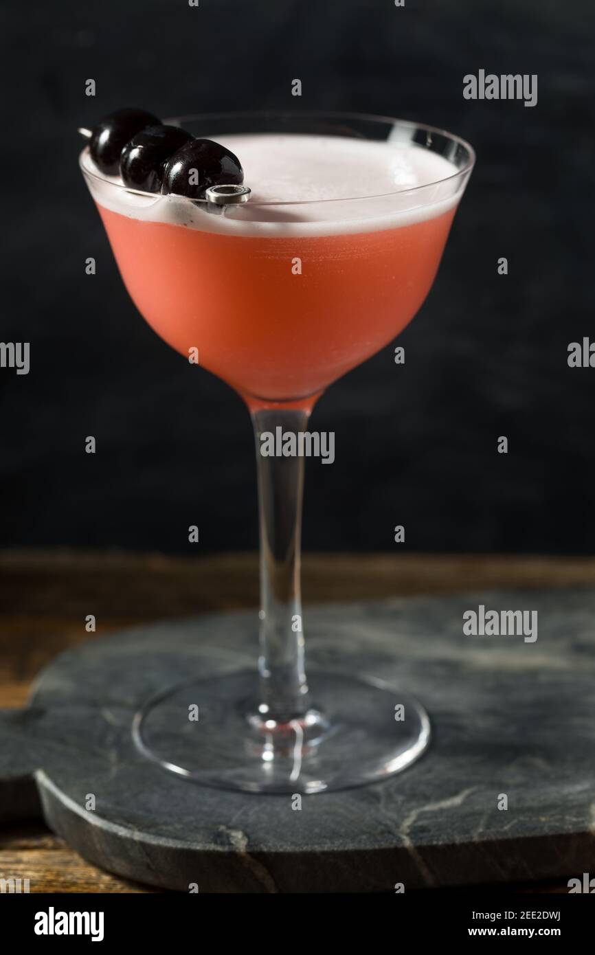 Refreshing Boozy Pink Lady Cocktail with Gin and Cherries Stock Photo ...