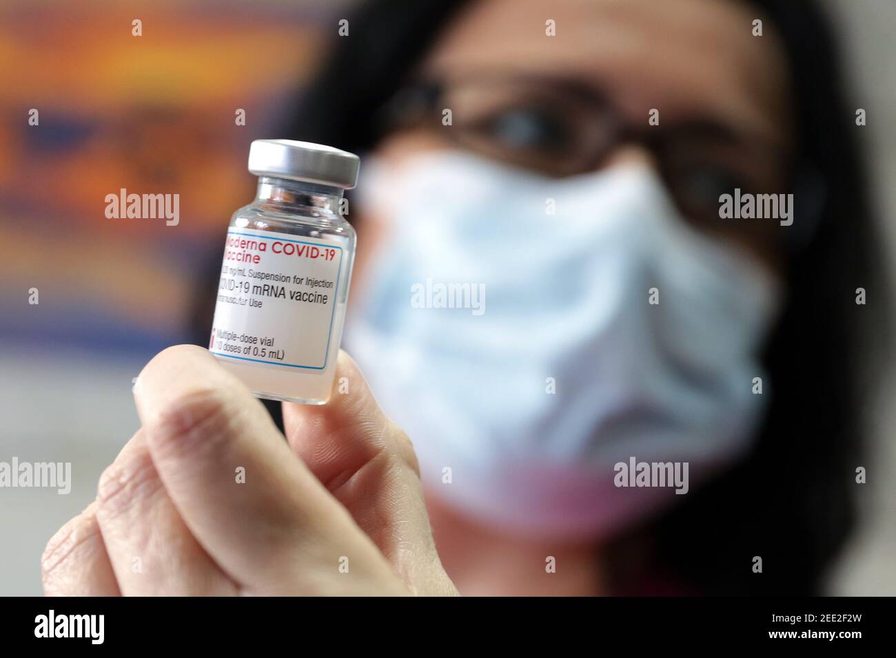 Sofia, Bulgaria - 14 January, 2021: A medical worker displays a vial of the Moderna COVID-19 ...