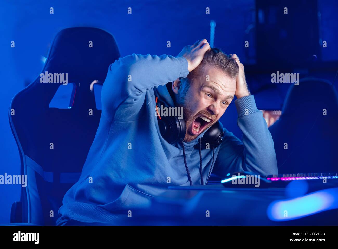 Streamer Angry computer gamer man yells after being defeated in online ...